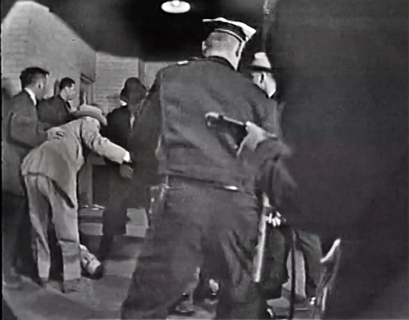 Jack Ruby shoots Lee Harvey Oswald @ Prayer Man